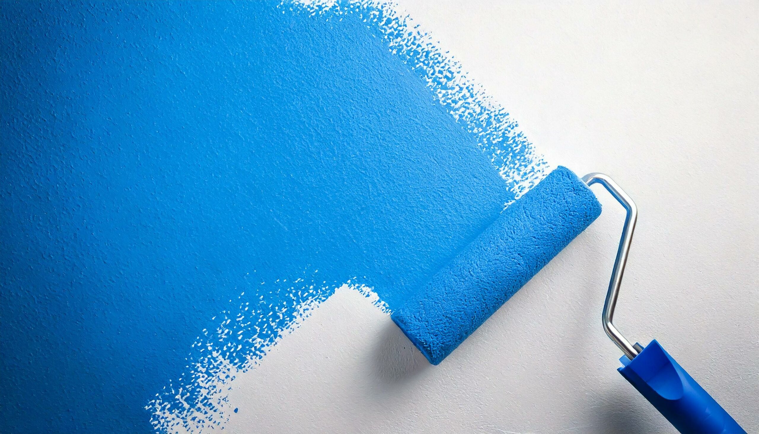 A blue paint roller painting a white wall with blue paint, editable ...
